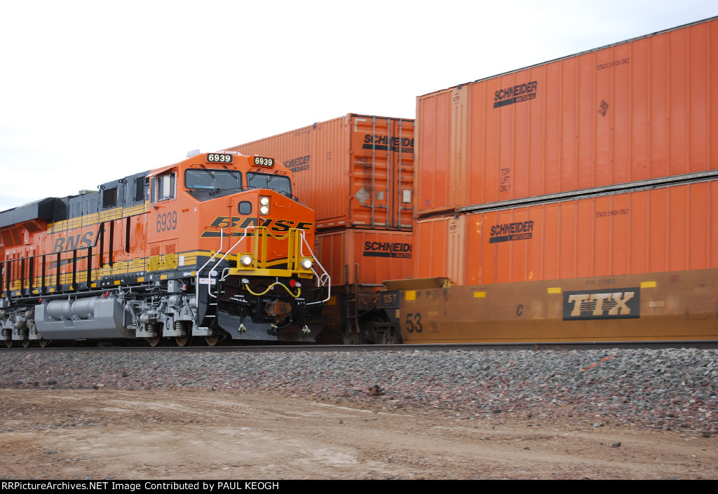 BNSF 6939 goes by the Double Stack Containers on Main 2 as she heads eastbound with a Manifest ...